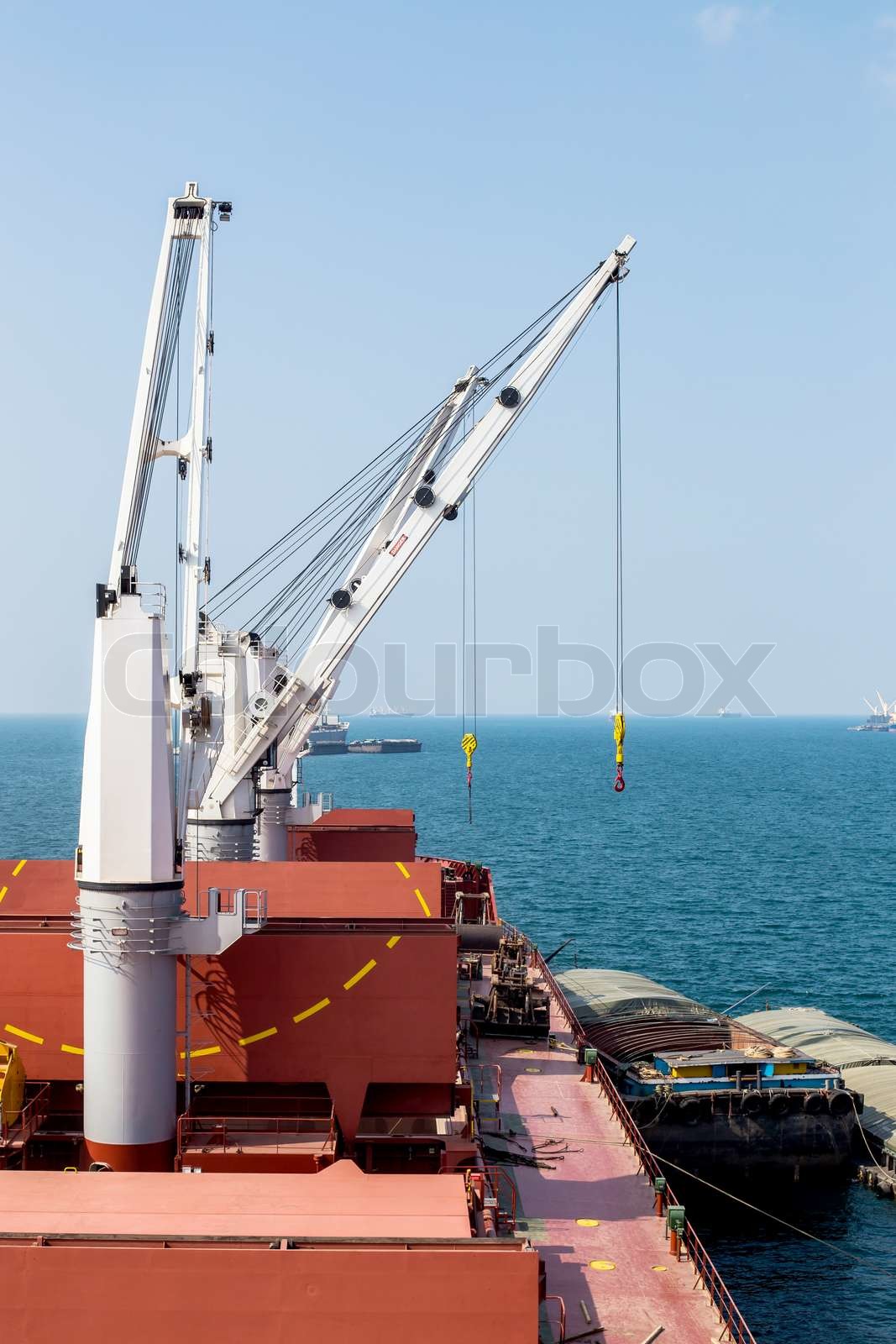 Lifting cranes on barges | Stock image | Colourbox