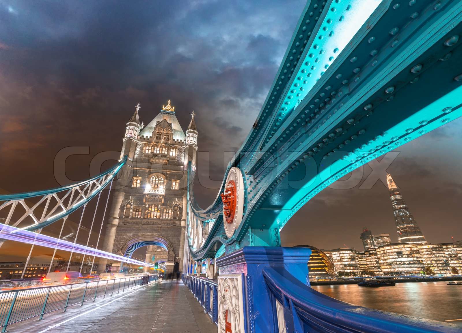 Night over Tower Bridge in London Blue shapes of metal structure ...