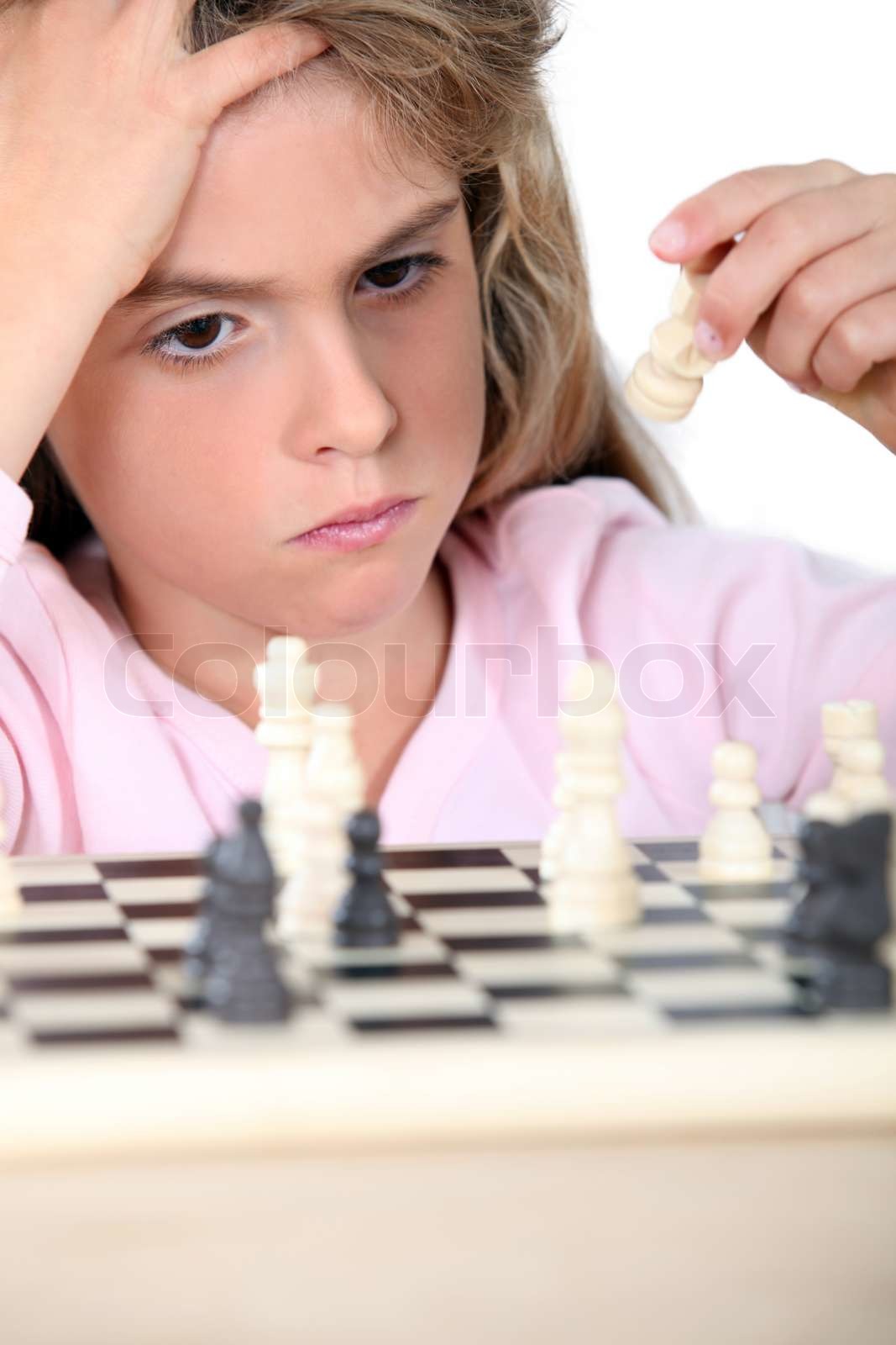Girl playing chess | Stock image | Colourbox