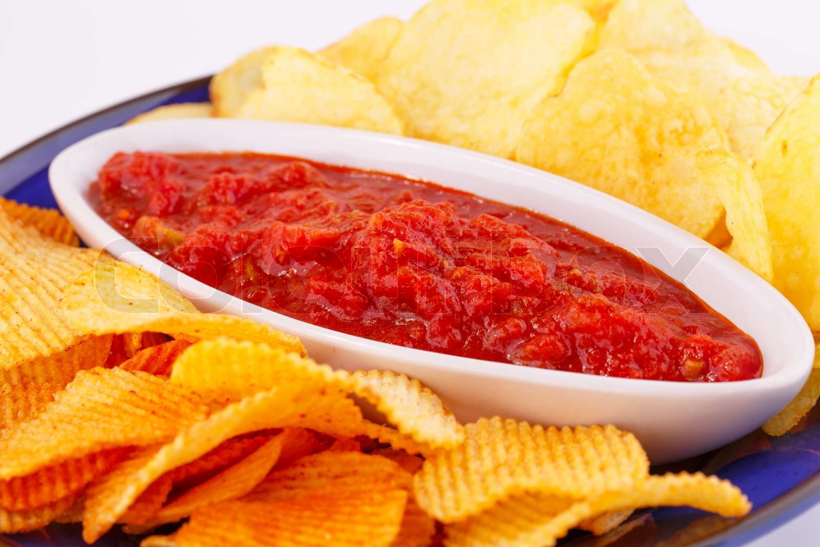 Potato chips and red sauce | Stock image | Colourbox