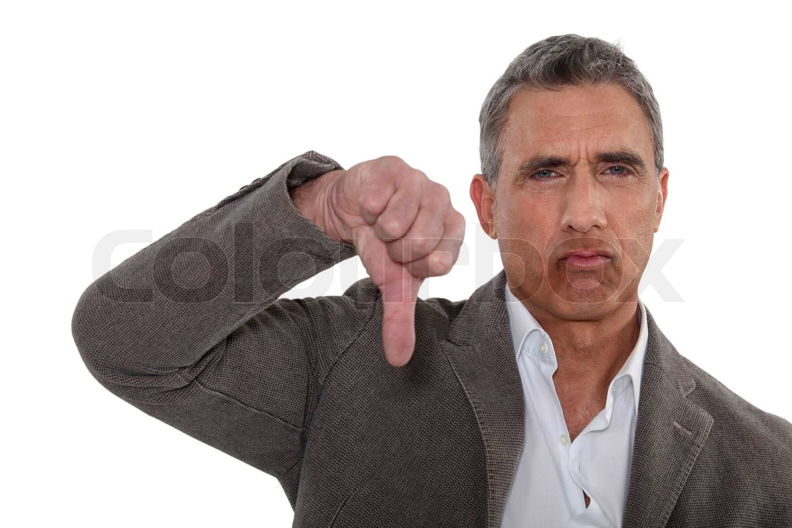 Thumbs down from a disapproving man | Stock image | Colourbox