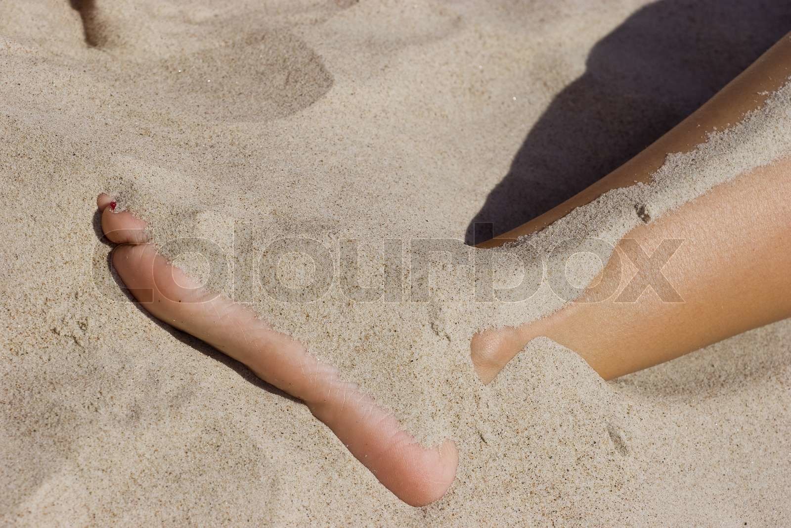 Leg in sand | Stock image | Colourbox