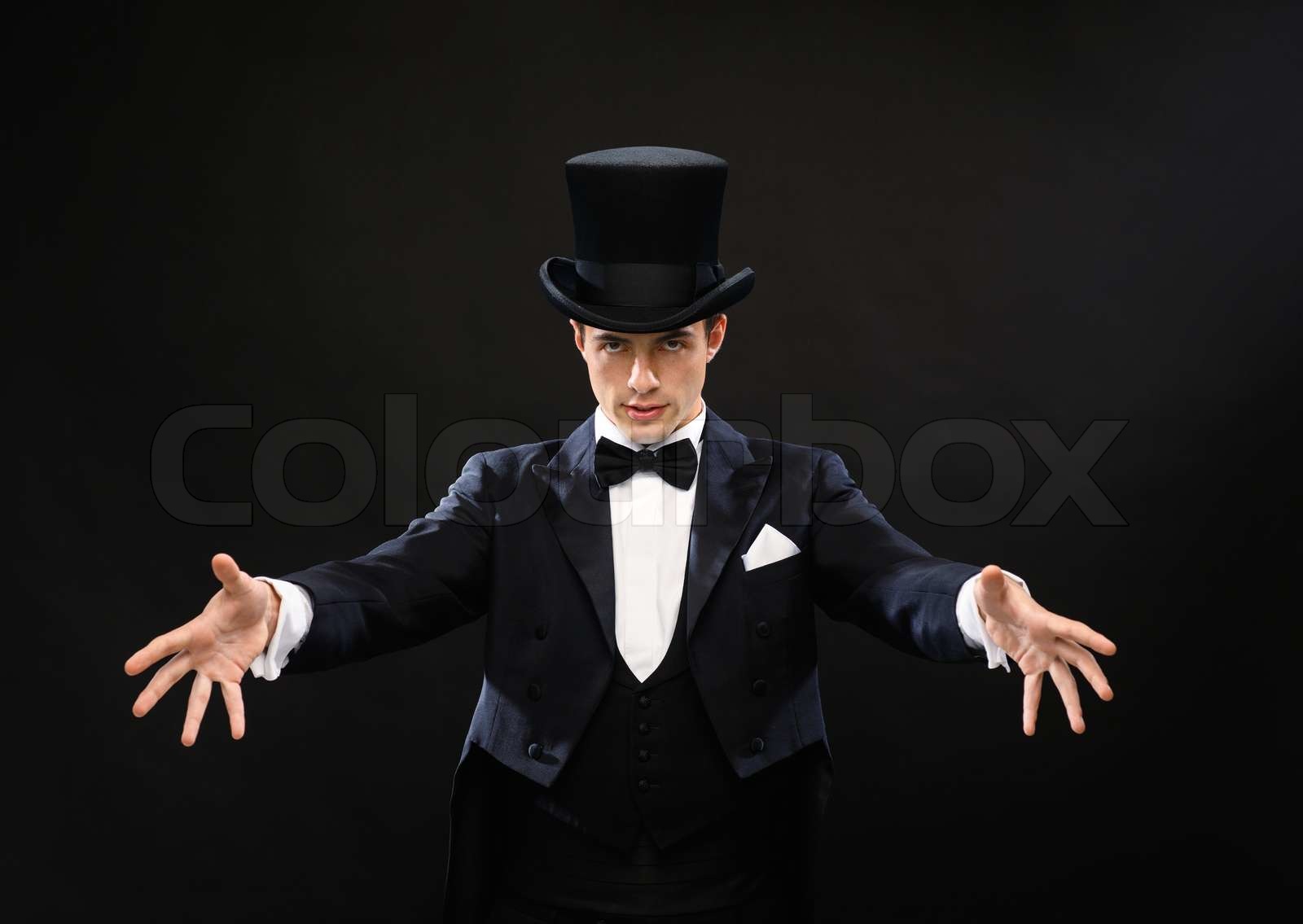 magician in top hat showing trick | Stock image | Colourbox
