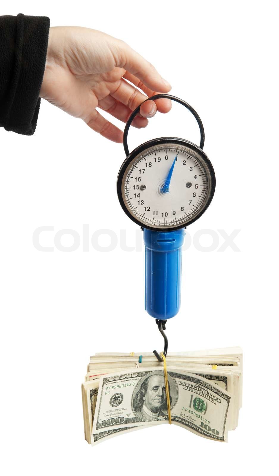 Weighing money | Stock image | Colourbox