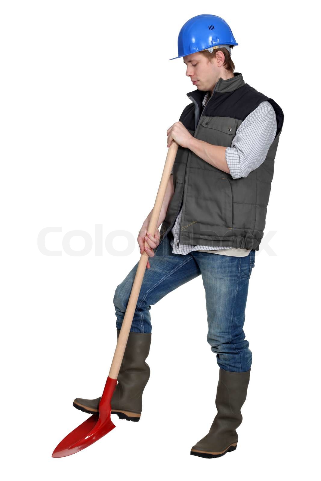 Tradesman using a spade | Stock image | Colourbox
