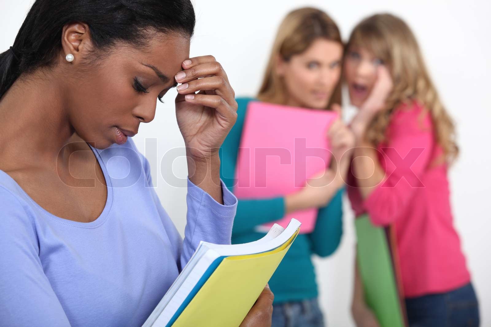Sad student excluded by friends | Stock image | Colourbox