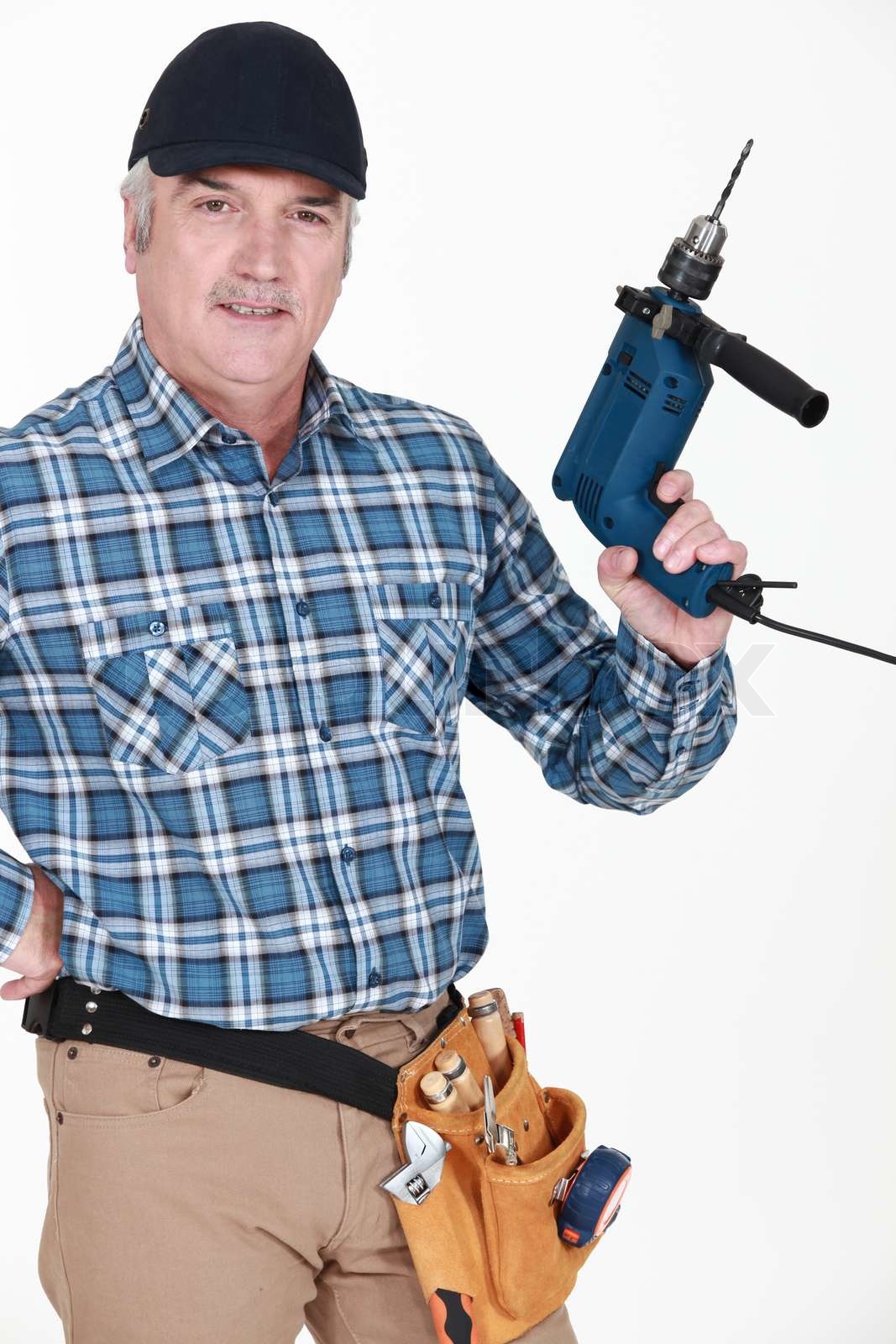 Man holding a power tool | Stock image | Colourbox