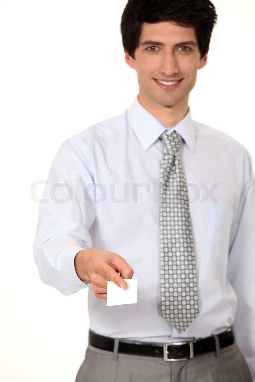 Businessman giving his card | Stock image | Colourbox