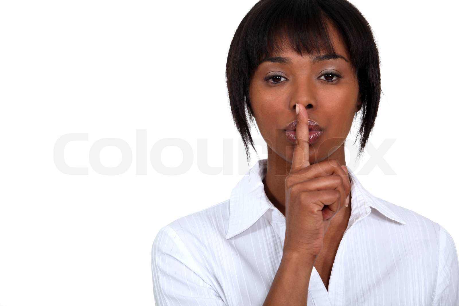 African American Frau shushing | Stock Bild | Colourbox