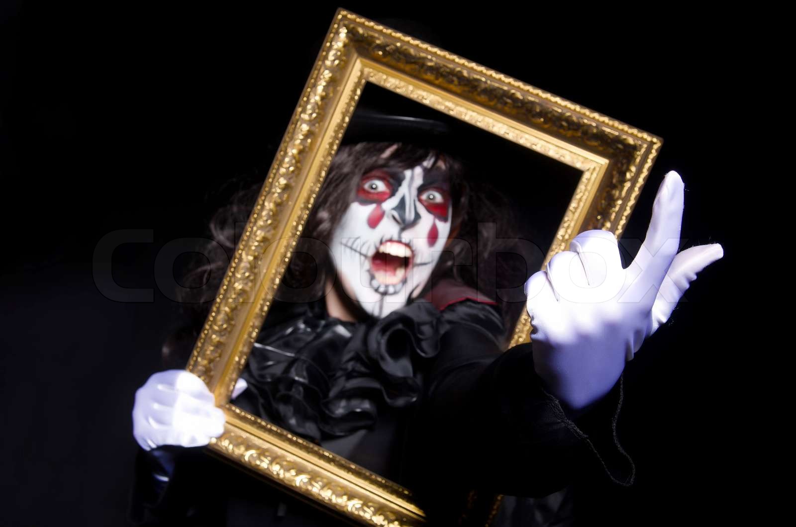 Monster with picture photo frame in dark room0 | Stock image | Colourbox