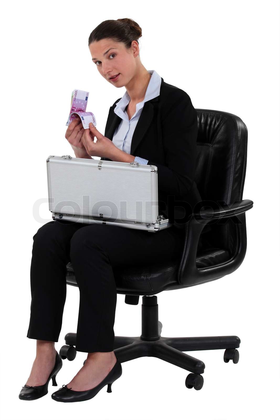 Woman counting her money | Stock image | Colourbox