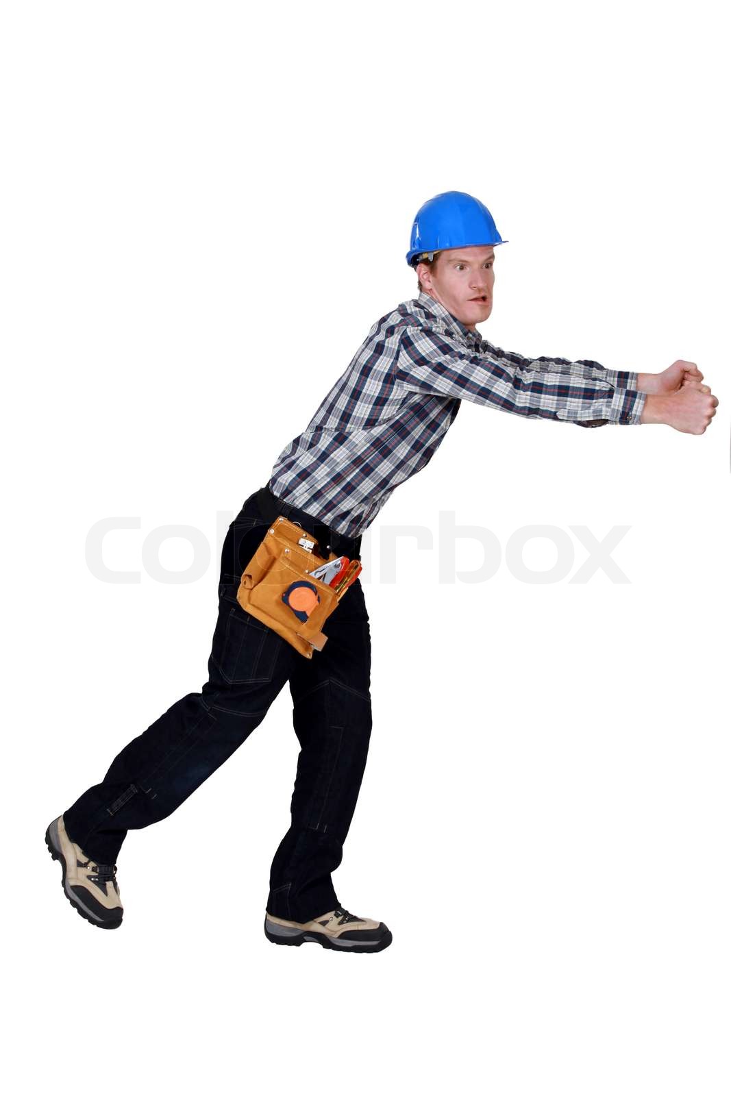 Construction worker pulling something | Stock image | Colourbox