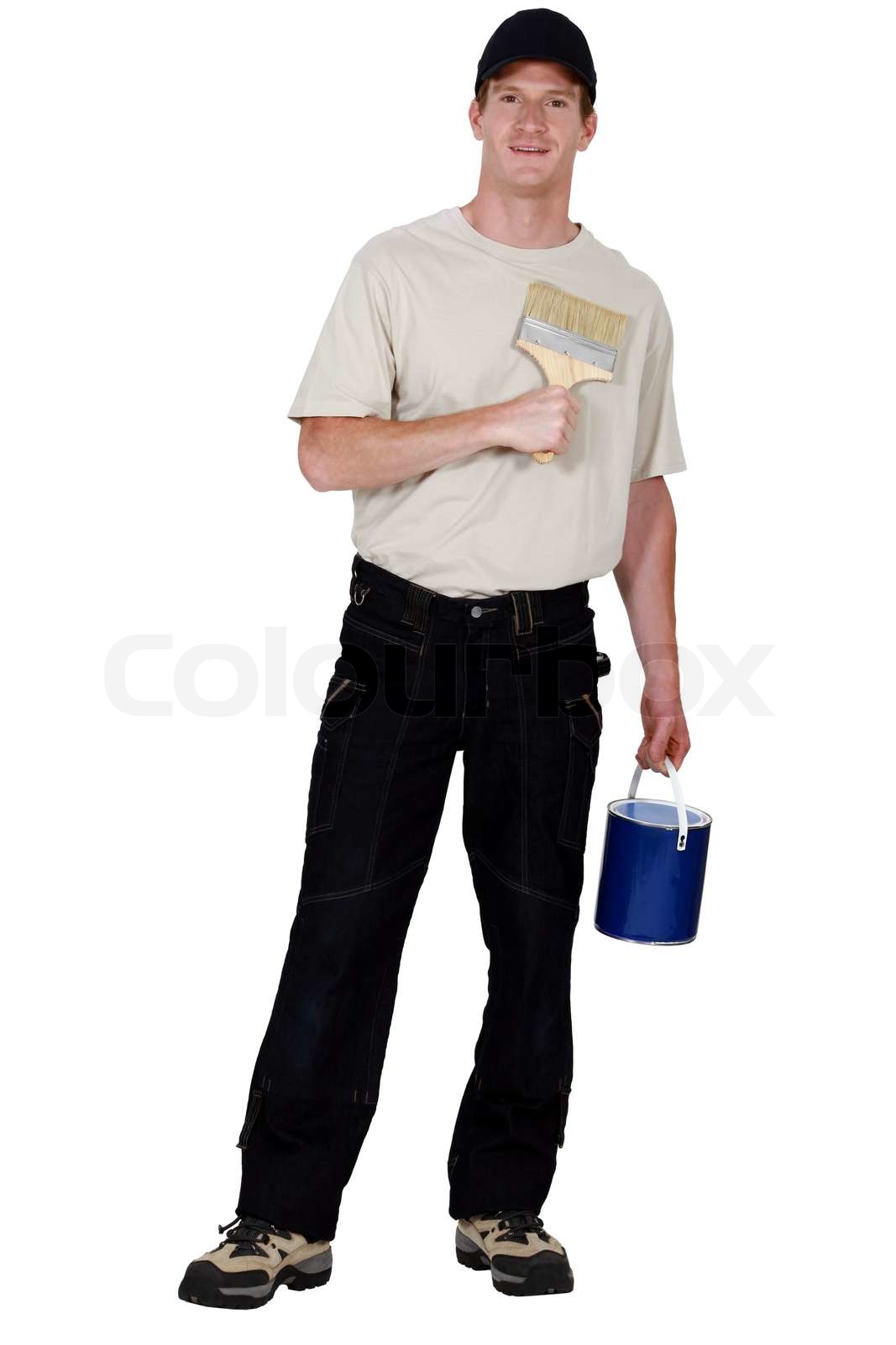 Handwerker Maler hält einen Pinsel und eine Dose | Stock Bild | Colourbox