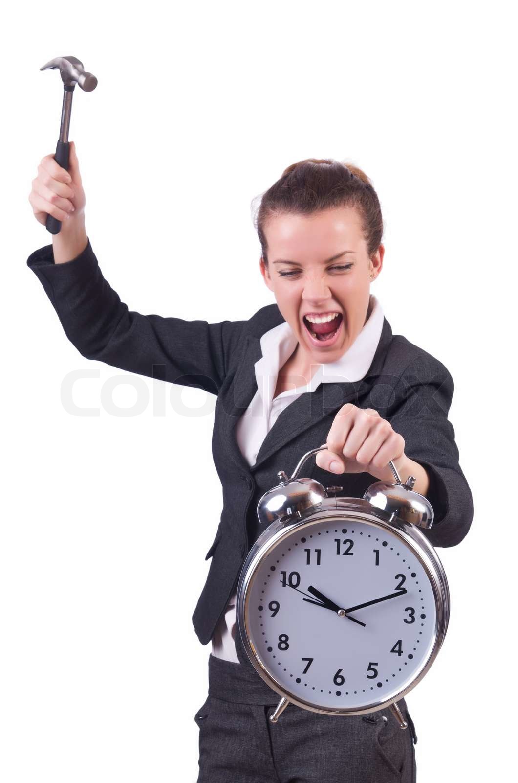 Woman trying to break the clock | Stock image | Colourbox