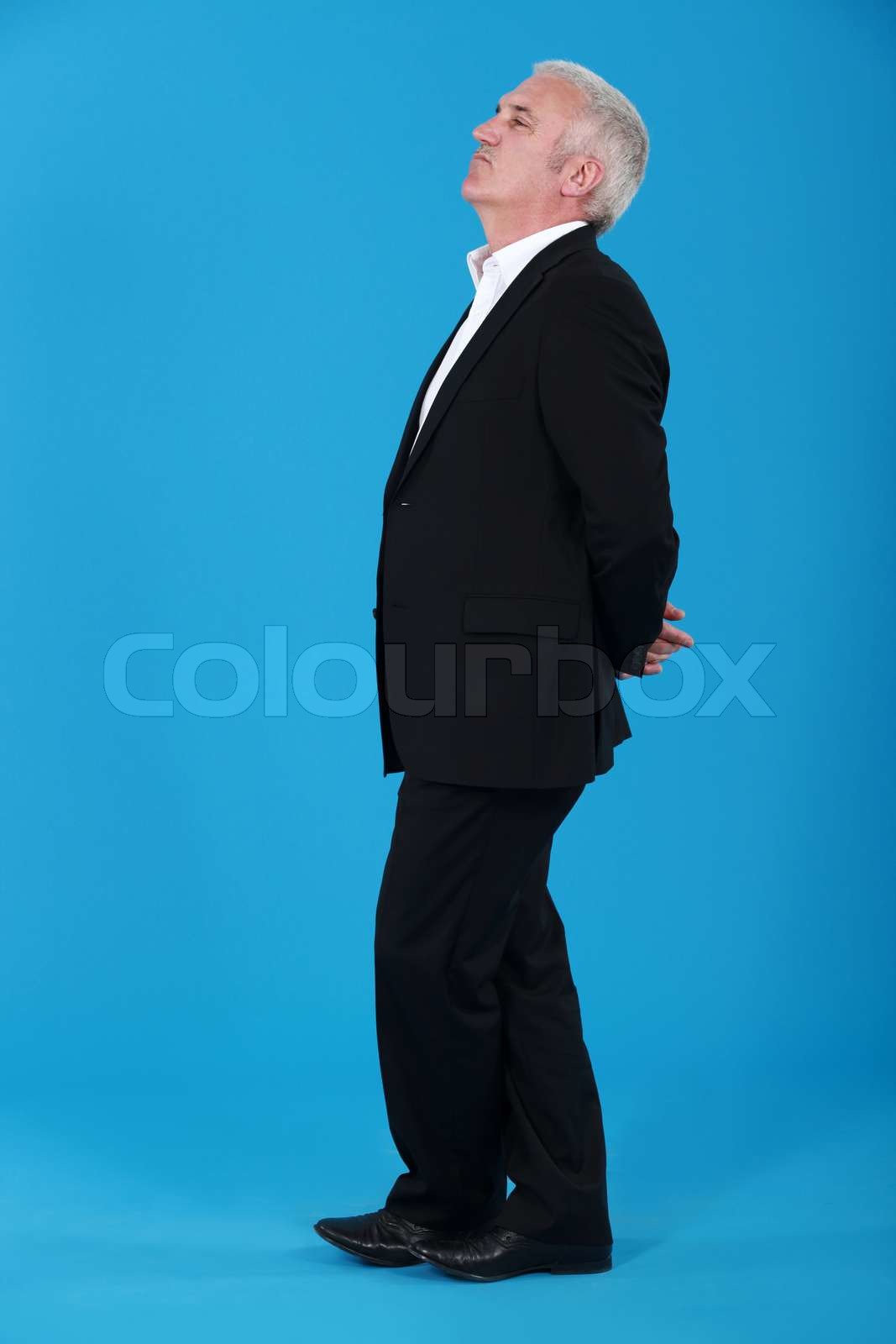 Man with arms behind back | Stock image | Colourbox