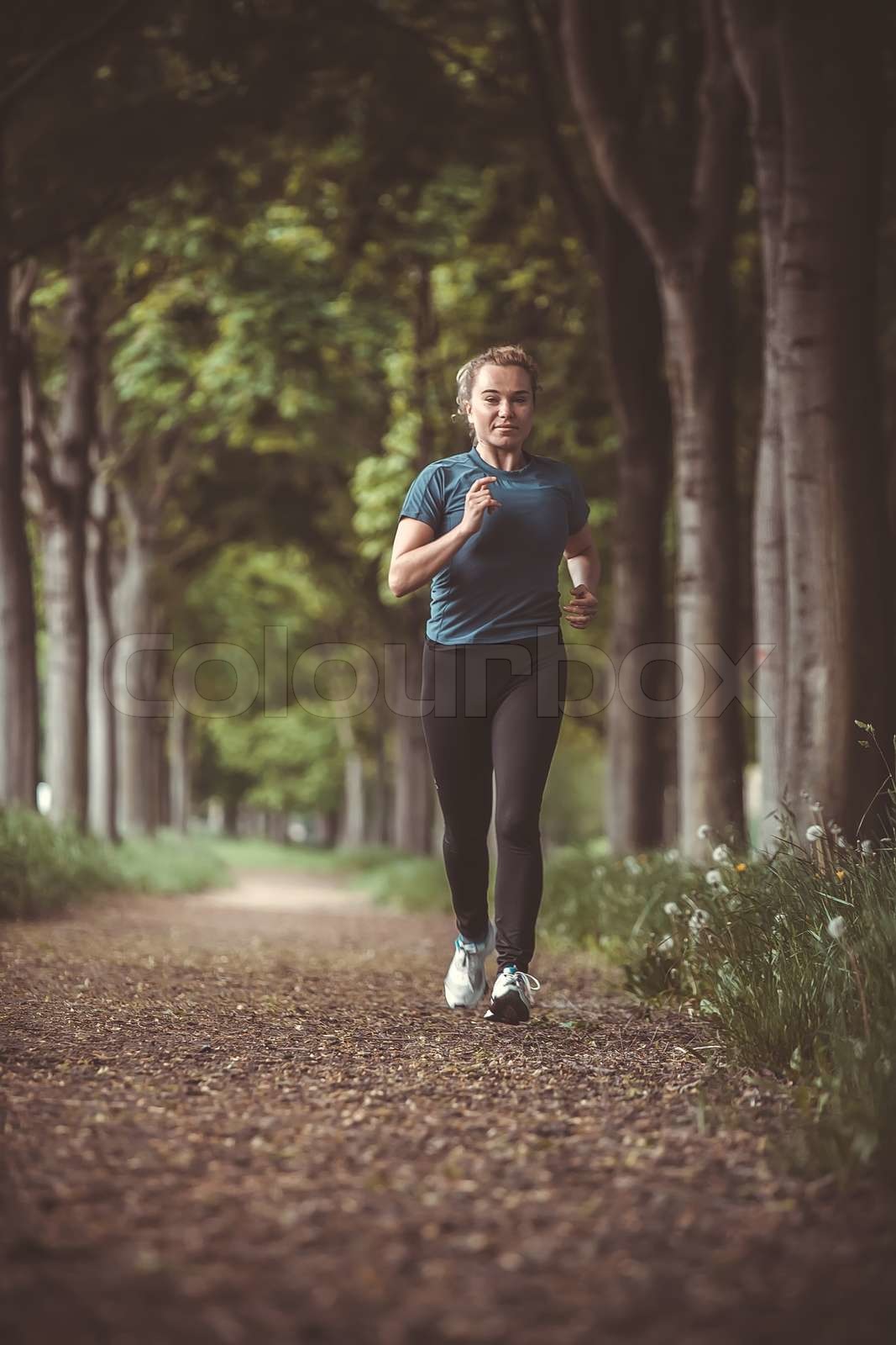 Marathon run in the autumn forest | Stock image | Colourbox