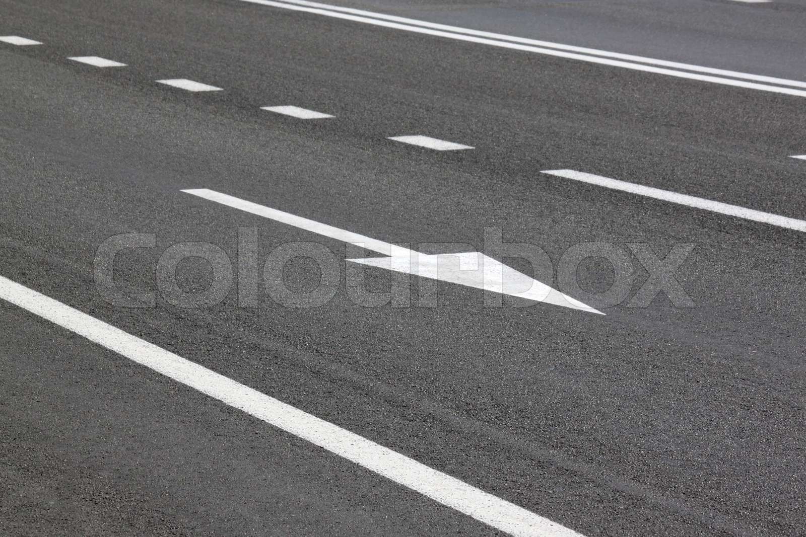dividing lines and arrow on road | Stock image | Colourbox