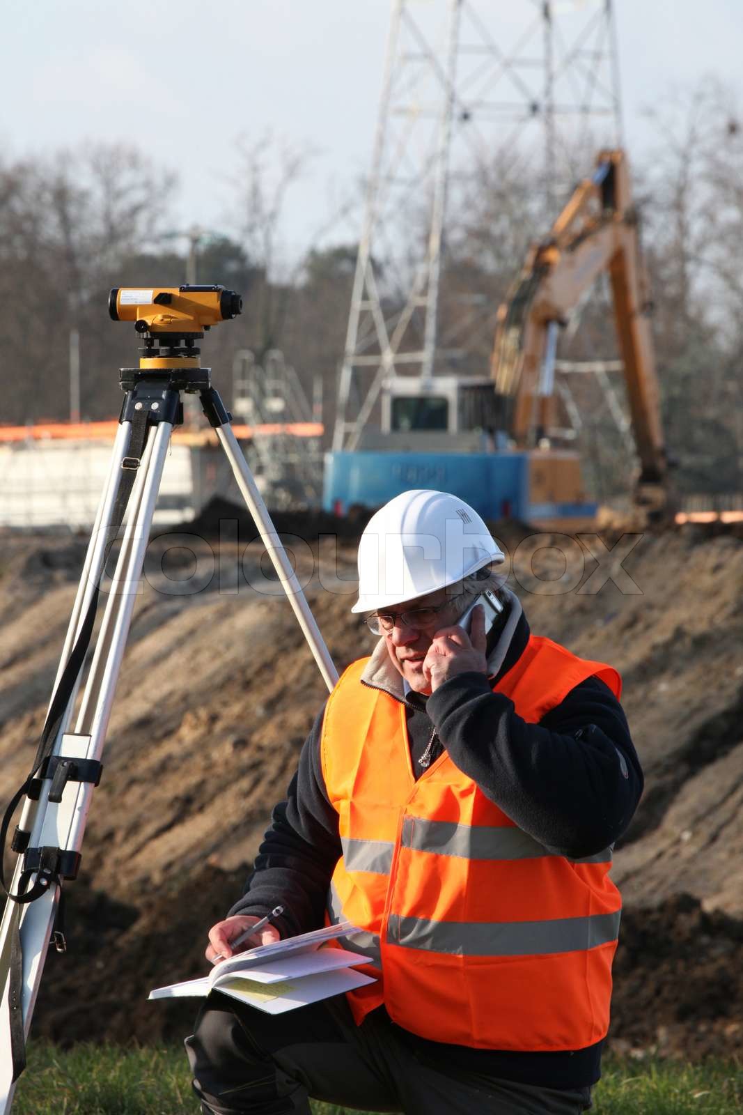 Surveyor at construction site | Stock image | Colourbox