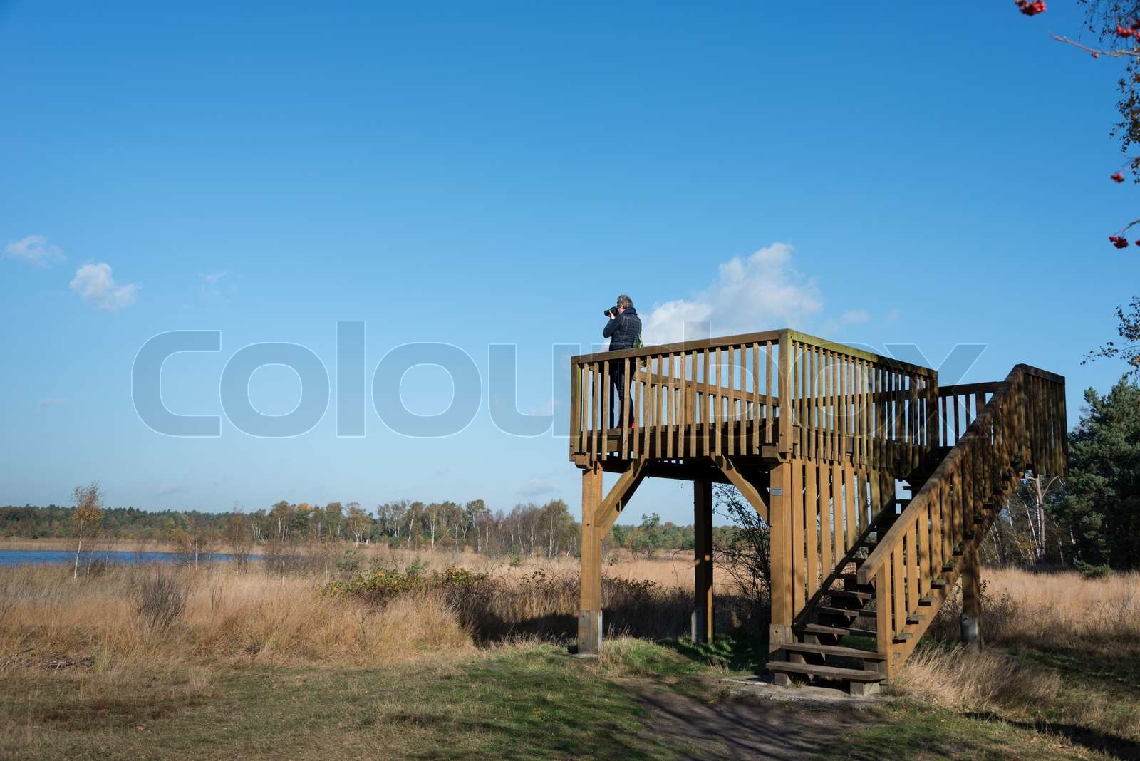 woman making photos from observation post | Stock image | Colourbox
