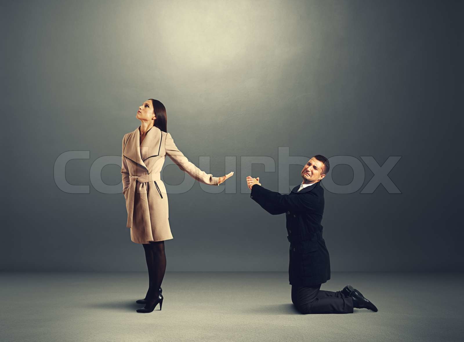 man standing on his knees and apologizing | Stock image | Colourbox