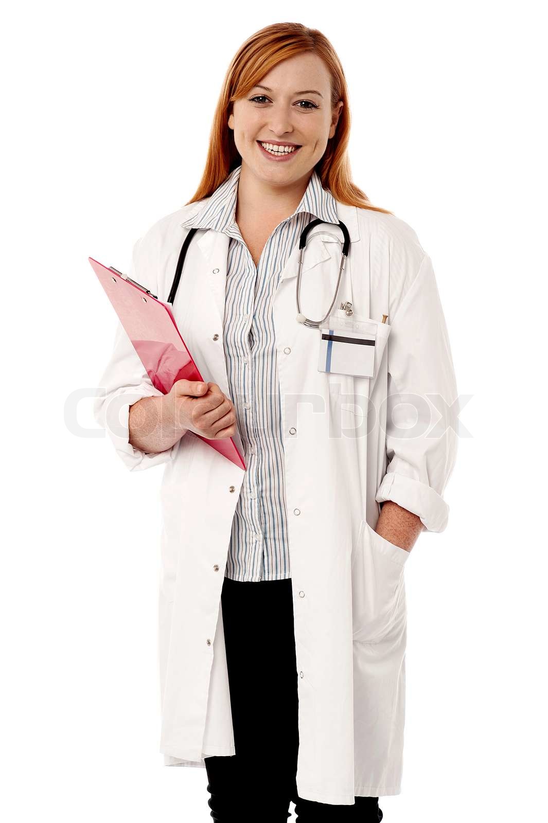 Young lady doctor holding clipboard | Stock image | Colourbox