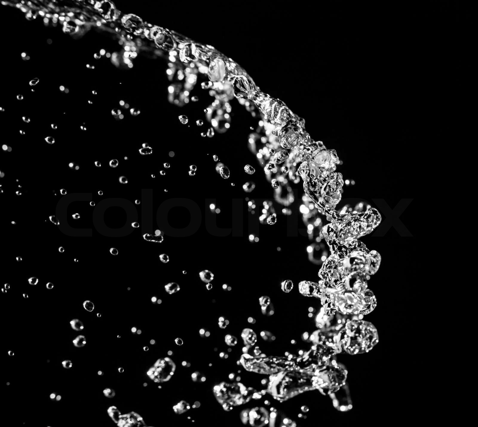 vandsprøjt på en sort baggrund | Stock foto | Colourbox