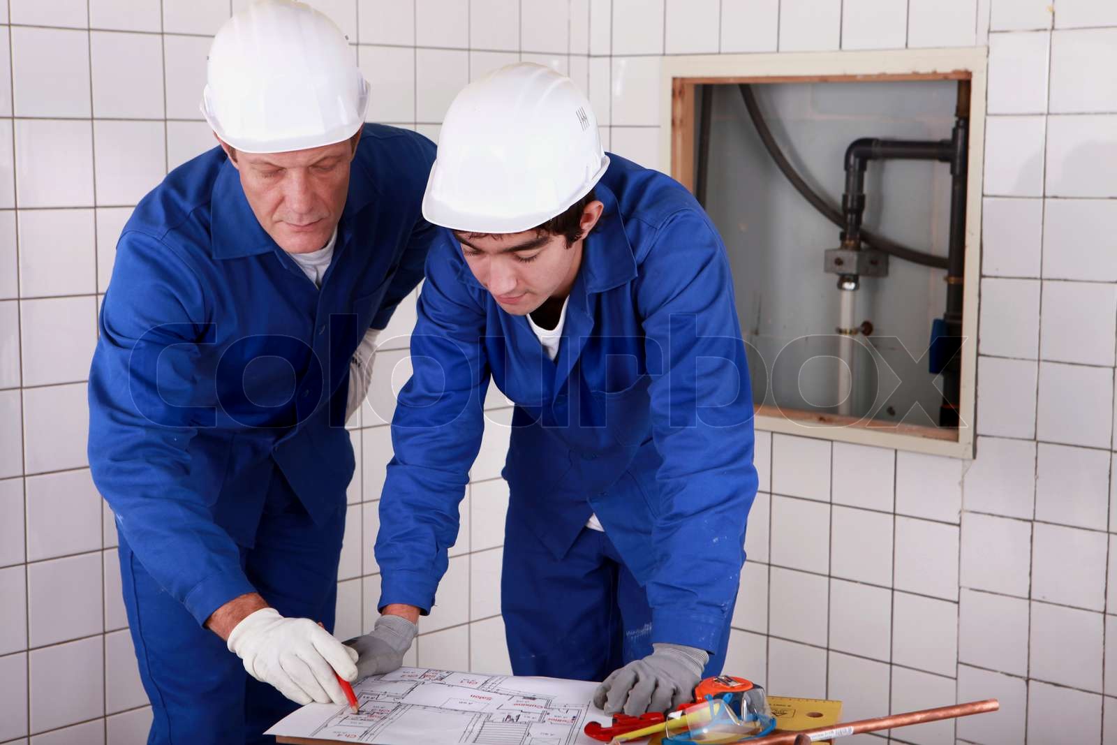 plumbers at work | Stock image | Colourbox