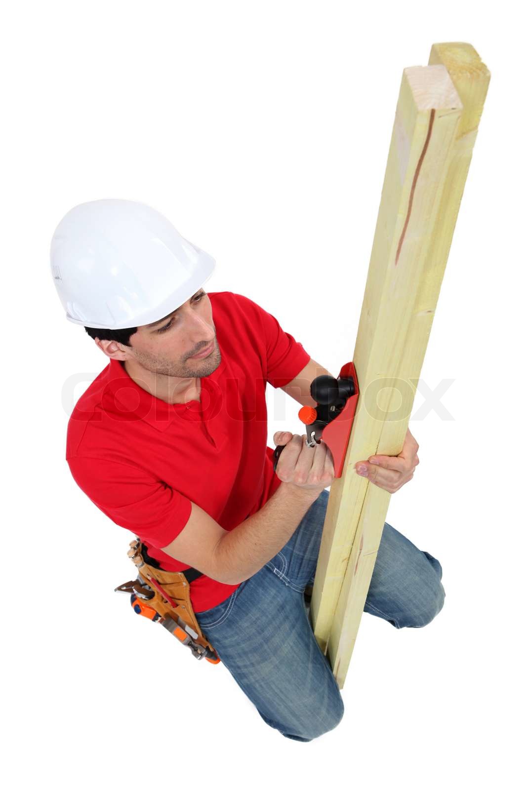 Carpenter planning wood | Stock image | Colourbox