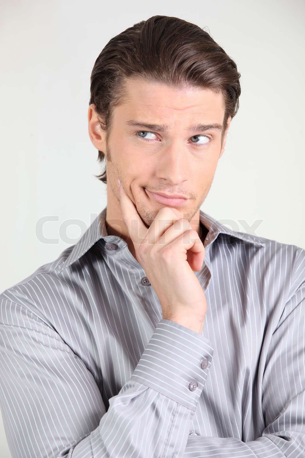 Smart man looking indifferent | Stock image | Colourbox