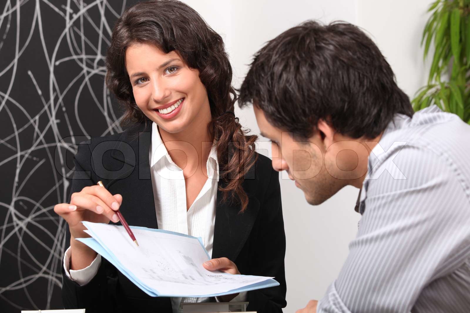 Businesswoman discussing a contract with her client | Stock image ...