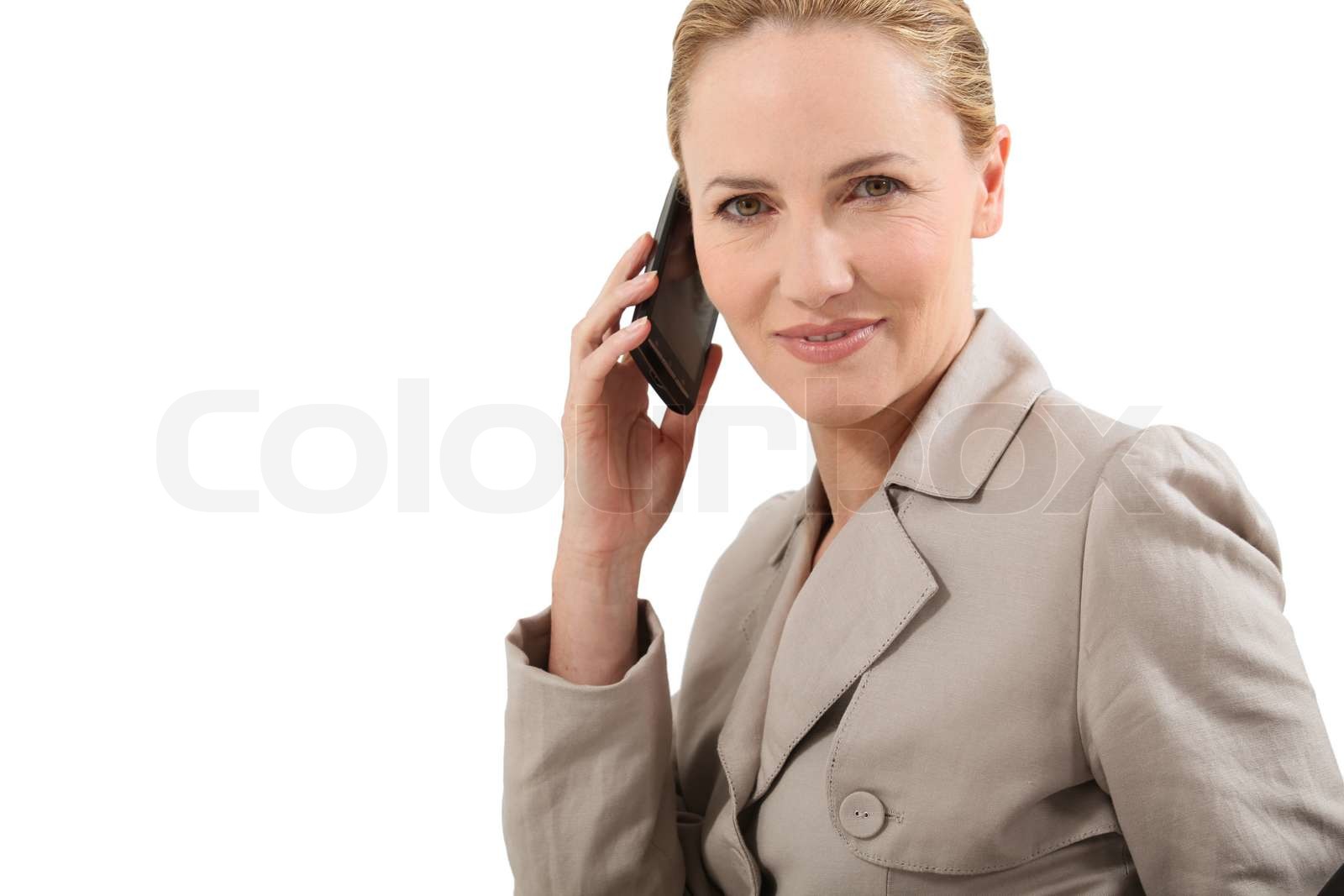 Schöne Frau mit Handy auf weißem Hintergrund | Stock Bild | Colourbox