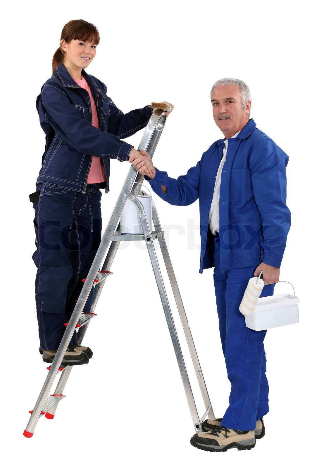 female apprentice and instructor shaking hands | Stock image | Colourbox