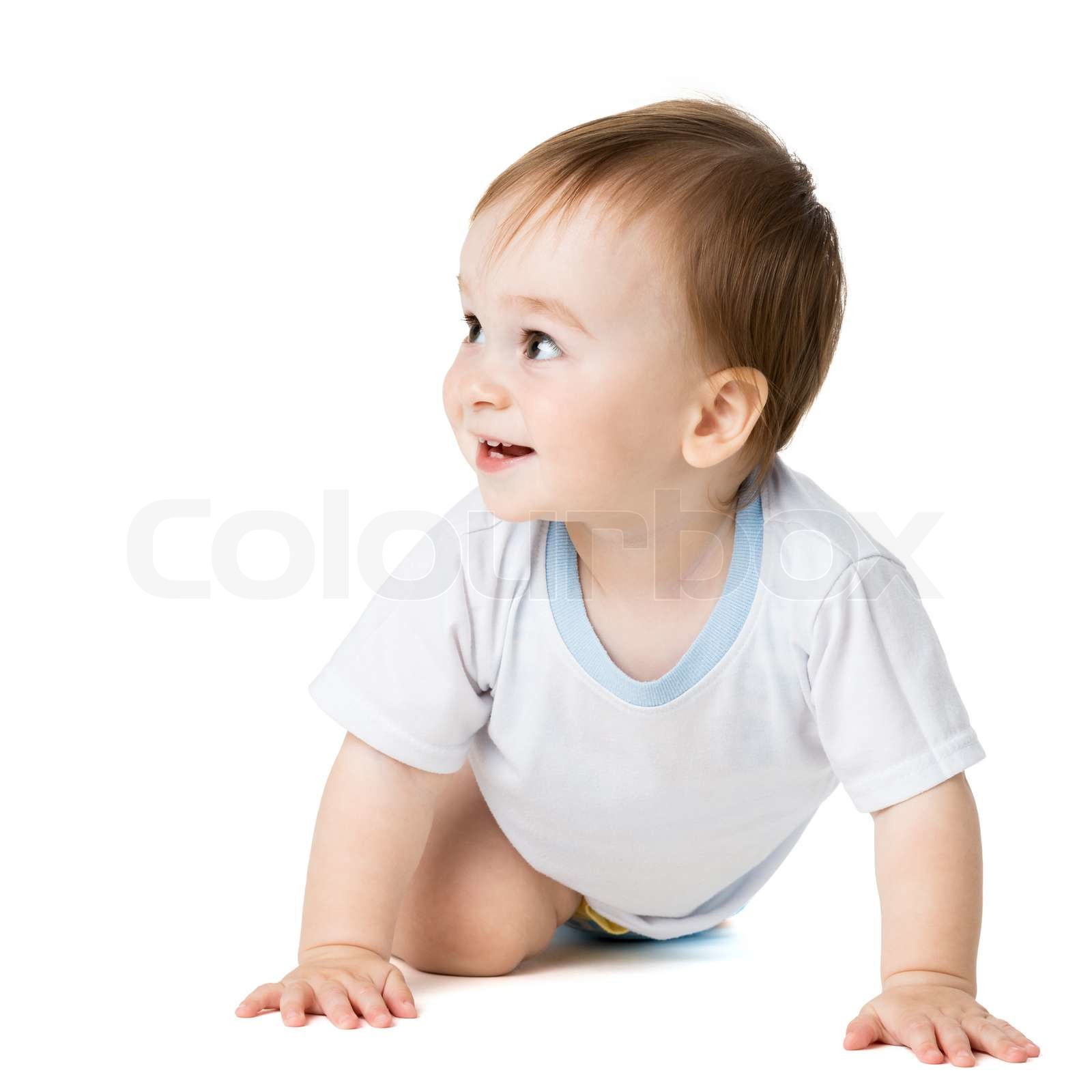 baby sitting and looking sideways | Stock image | Colourbox
