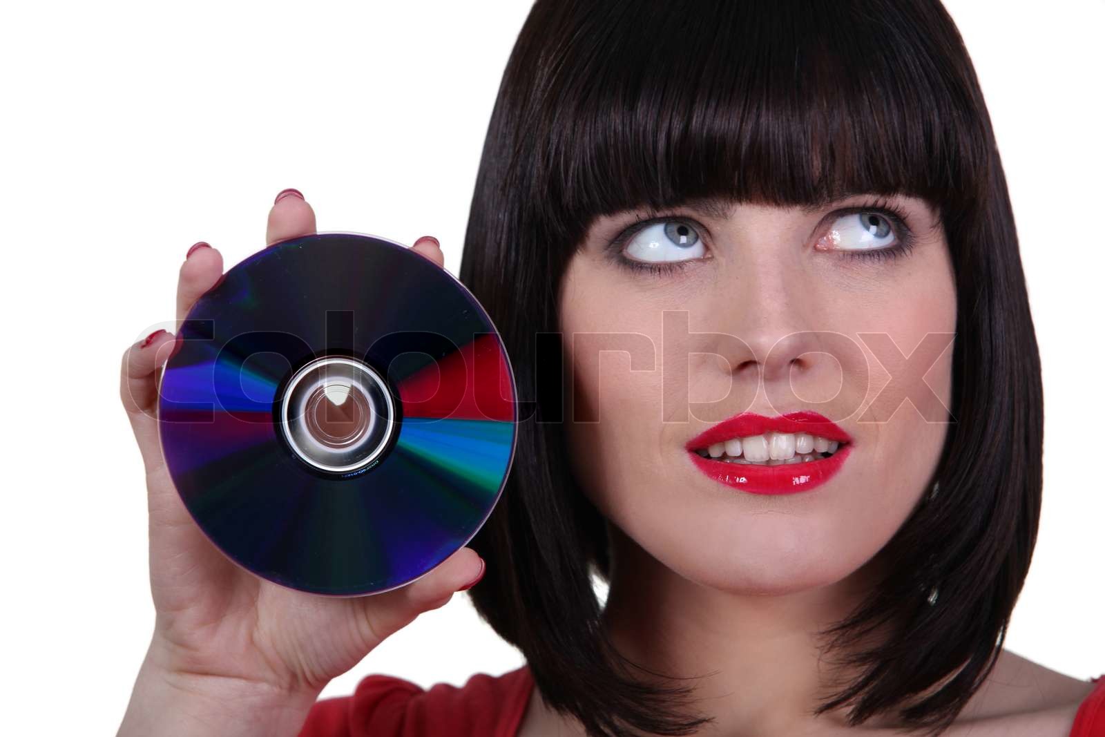 Woman showing CD | Stock image | Colourbox