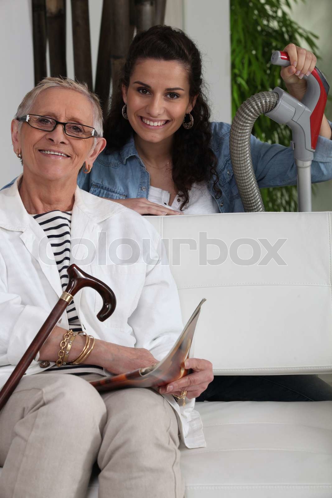 Woman helping an elderly lady | Stock image | Colourbox