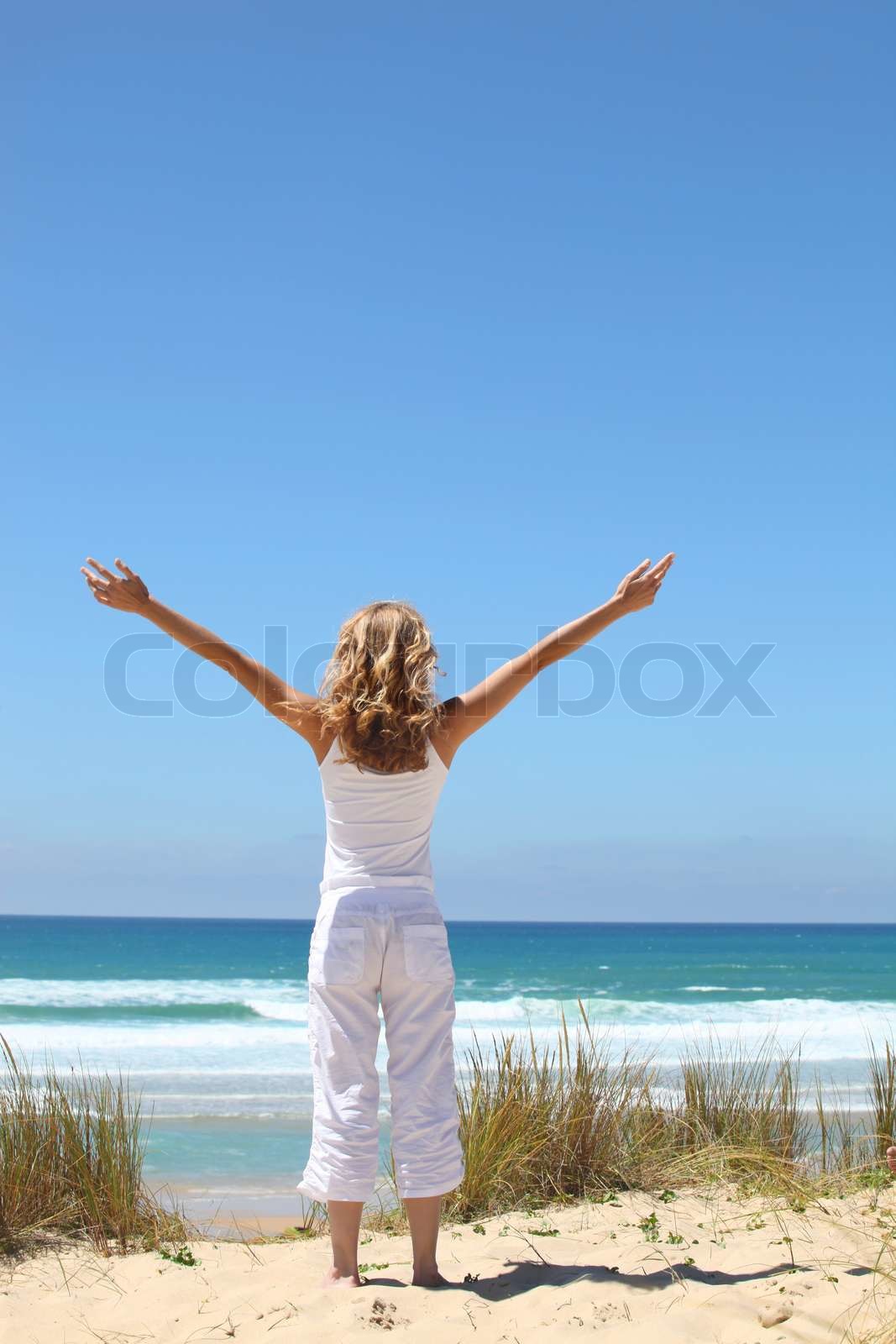 Woman with arms in the air | Stock image | Colourbox