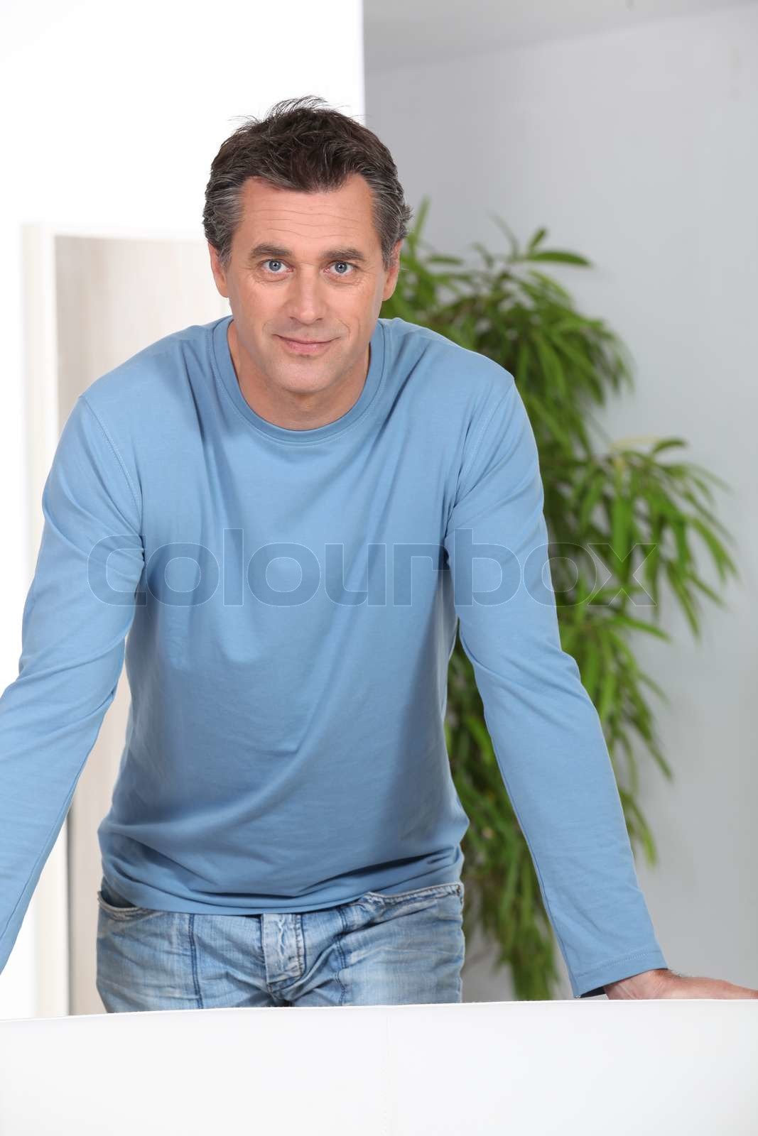Portrait of a man in his home | Stock image | Colourbox