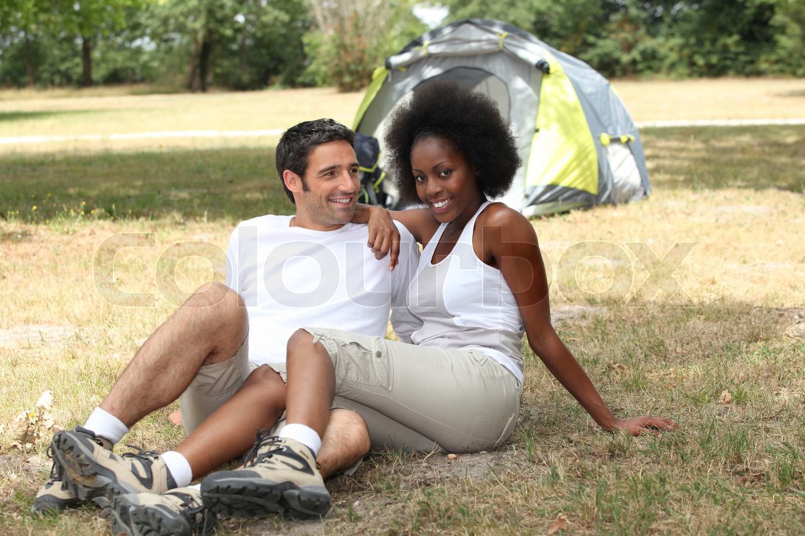 mixed couple camping | Stock image | Colourbox