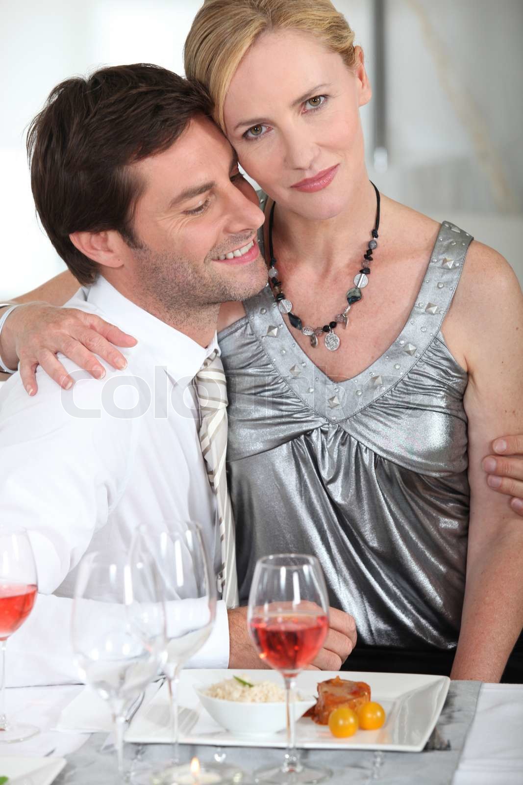 Woman sitting on man's lap | Stock image | Colourbox