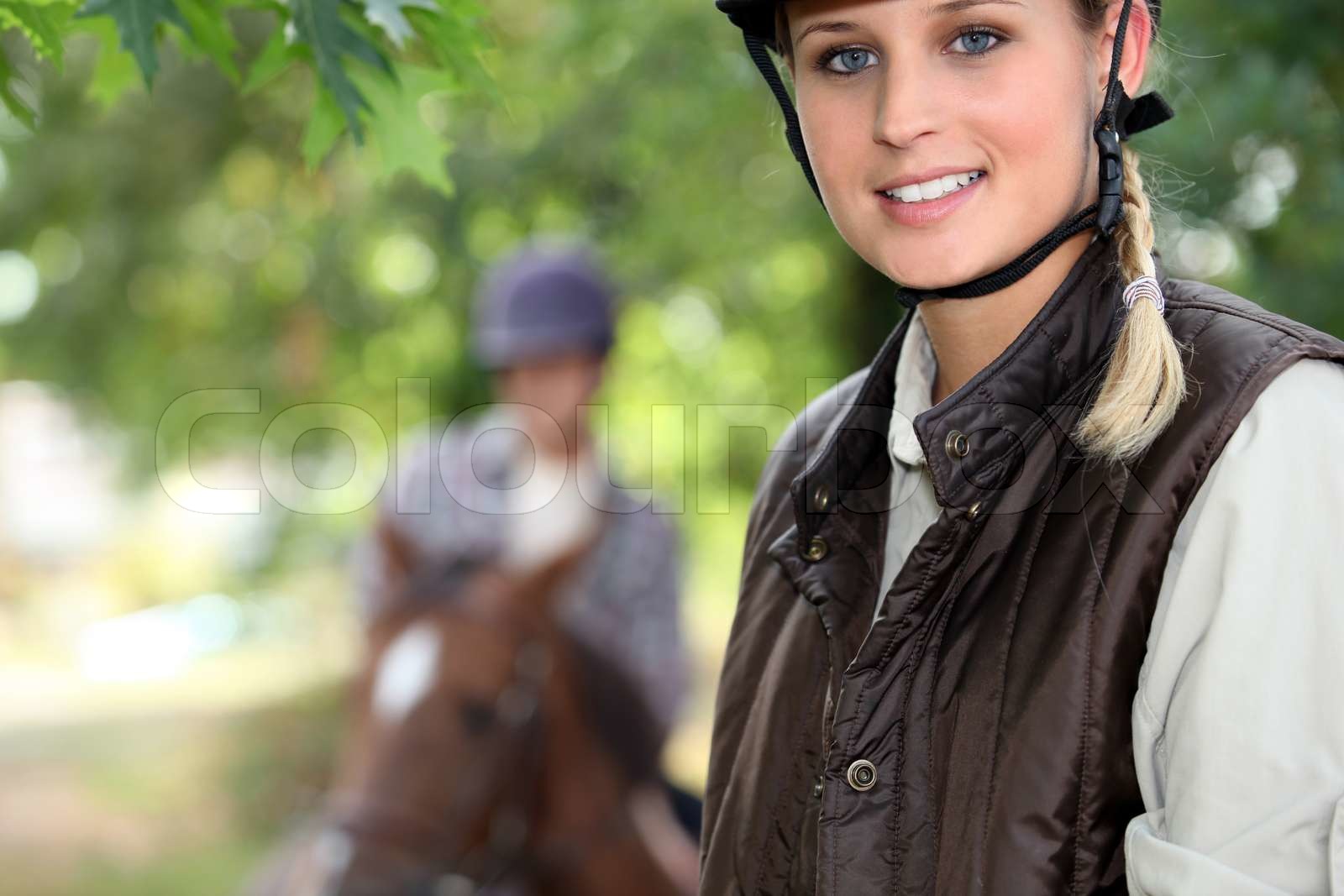 young woman riding a horse | Stock image | Colourbox
