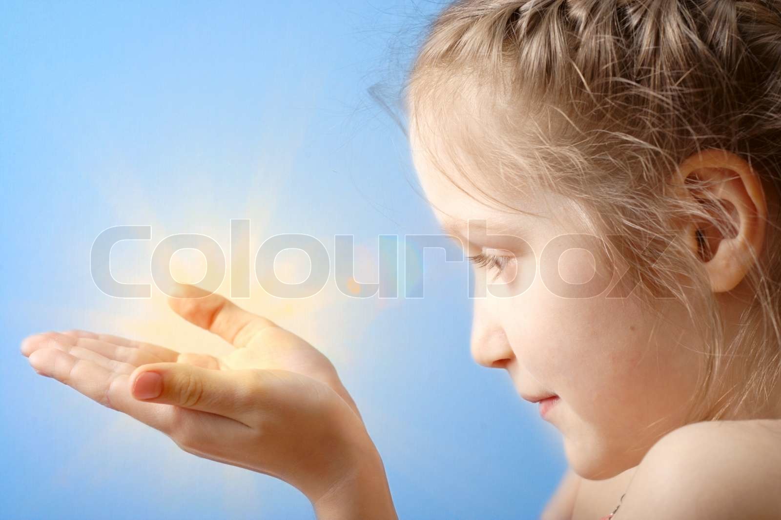 child holding a sun | Stock image | Colourbox