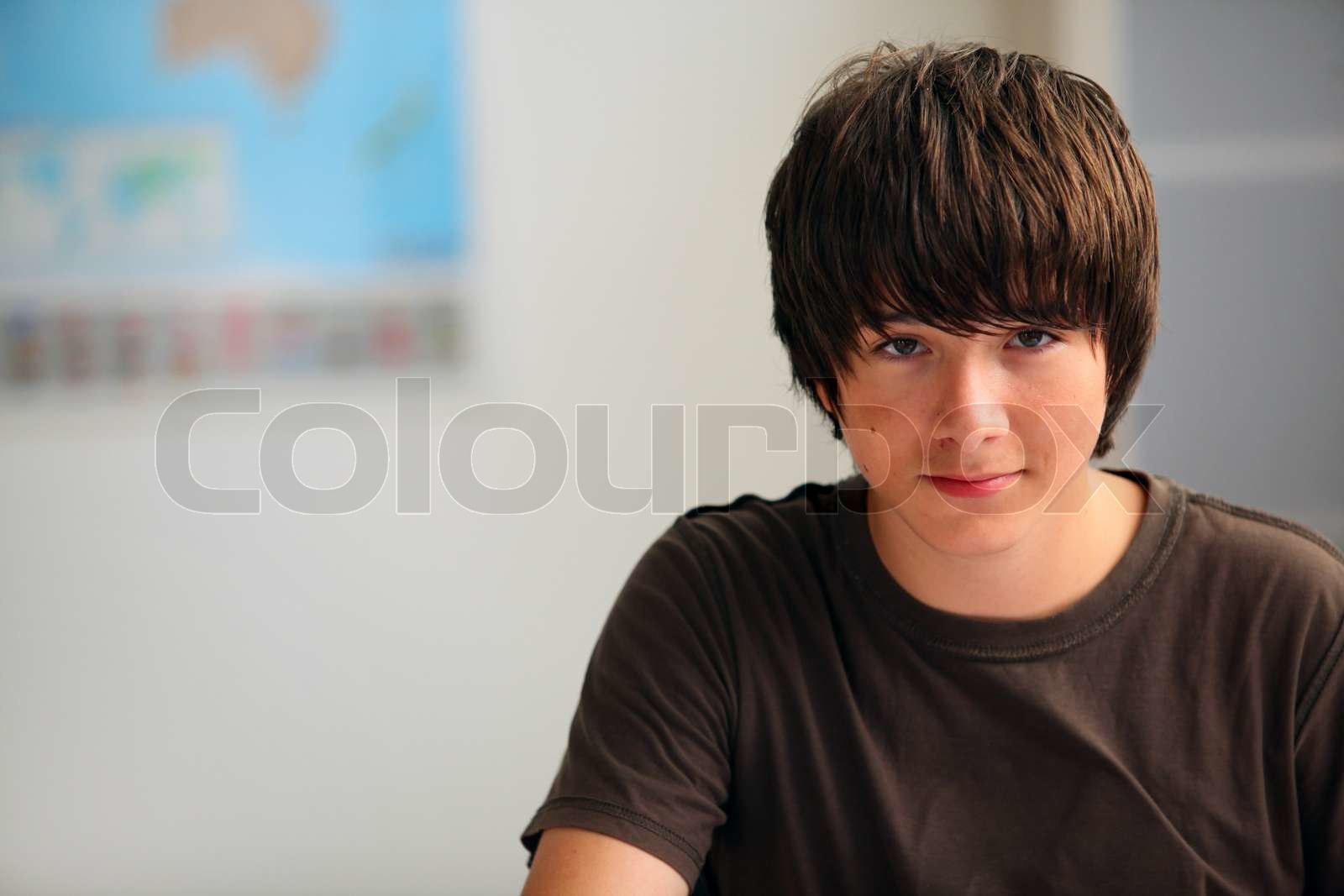 Boy sitting in a classroom | Stock image | Colourbox