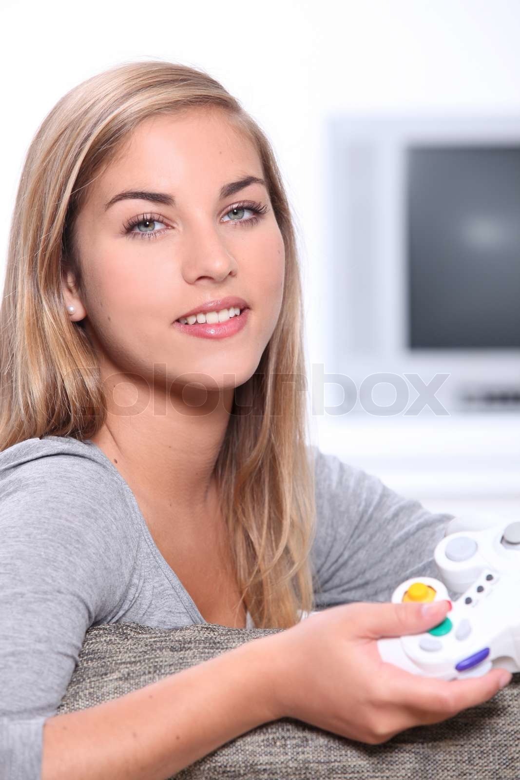 Teenage girl with games controller | Stock image | Colourbox