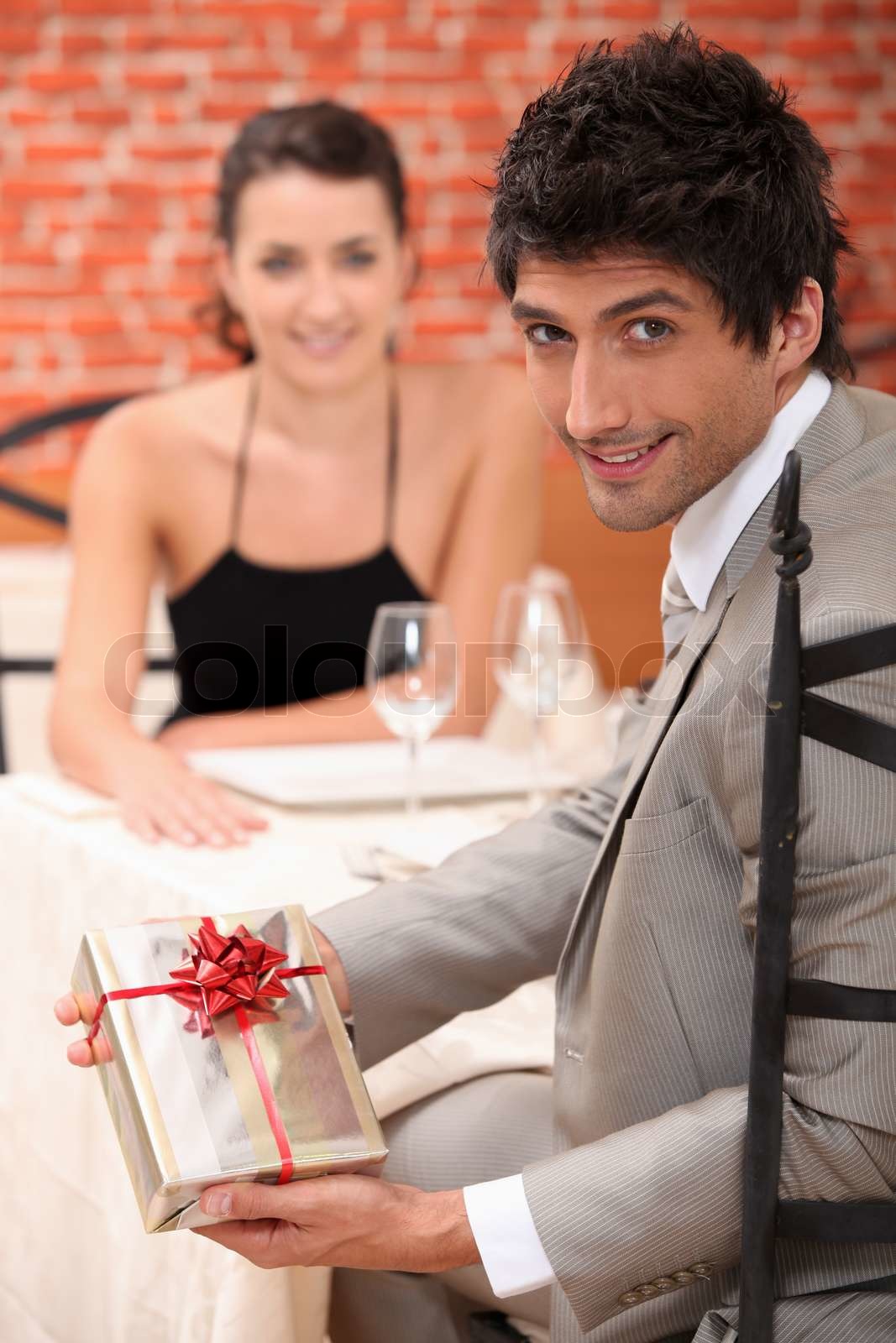 Man giving gift to woman | Stock image | Colourbox