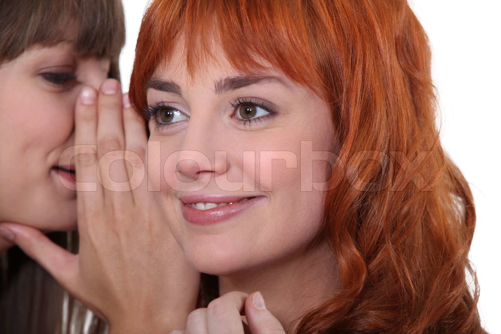 Whispering a secret | Stock image | Colourbox