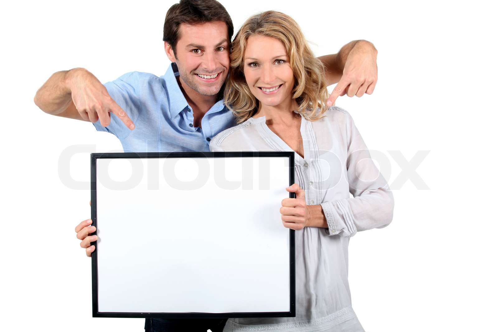 couple holding a frame | Stock image | Colourbox
