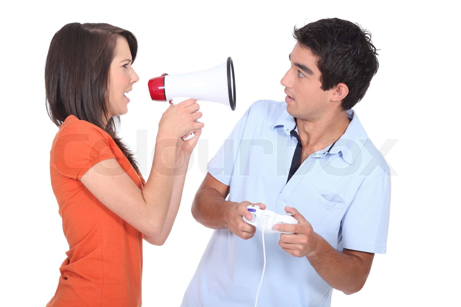 Girl shouting in loud speaker | Stock image | Colourbox