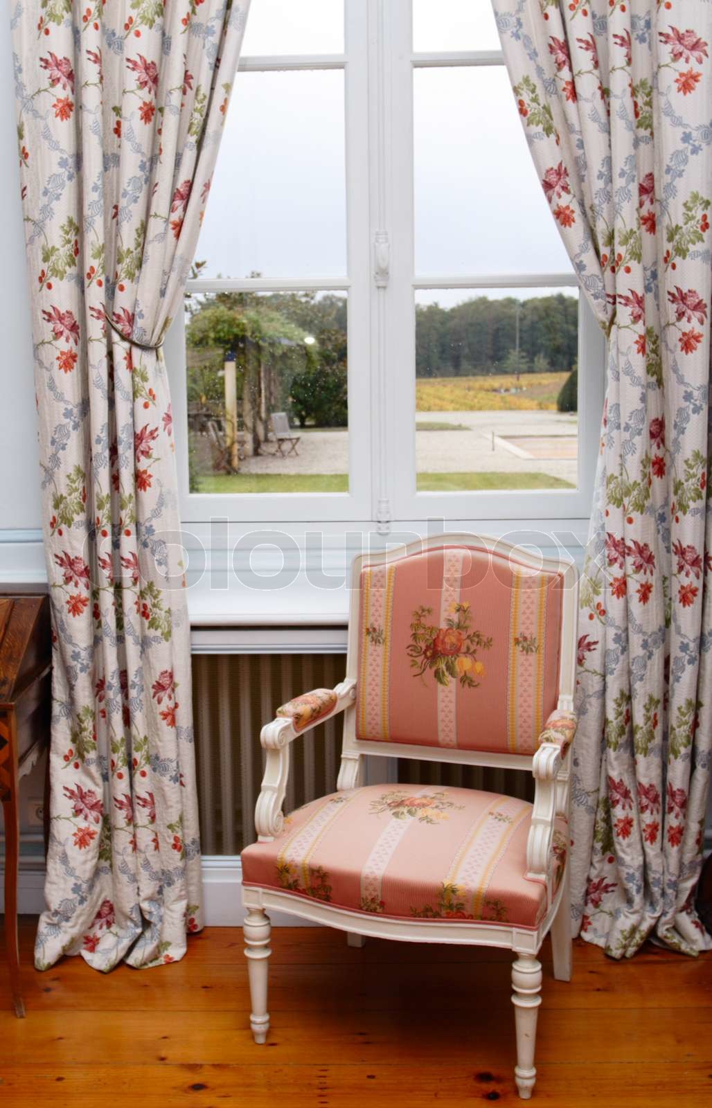 armchair close to window | Stock image | Colourbox