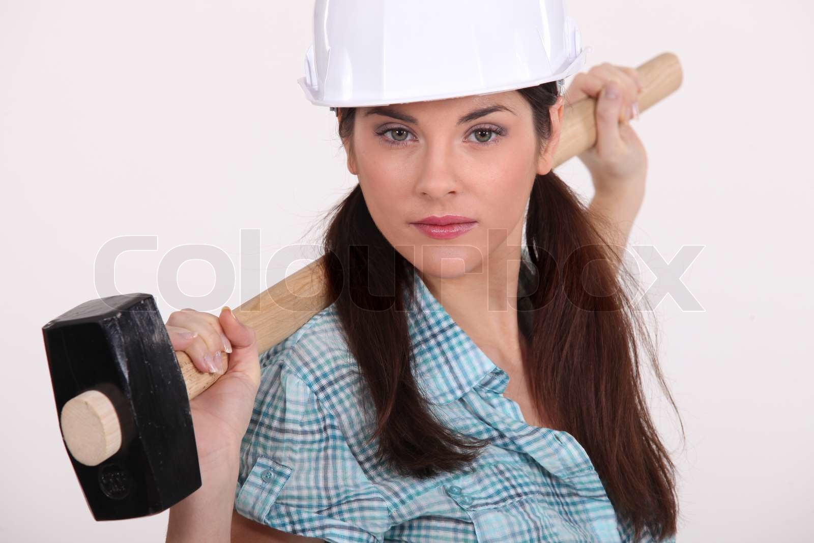Woman holding hammer | Stock image | Colourbox