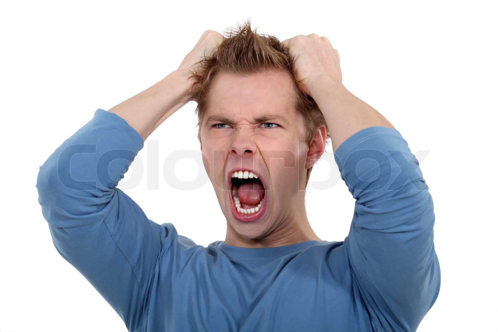 Man screaming and pulling his hair | Stock image | Colourbox